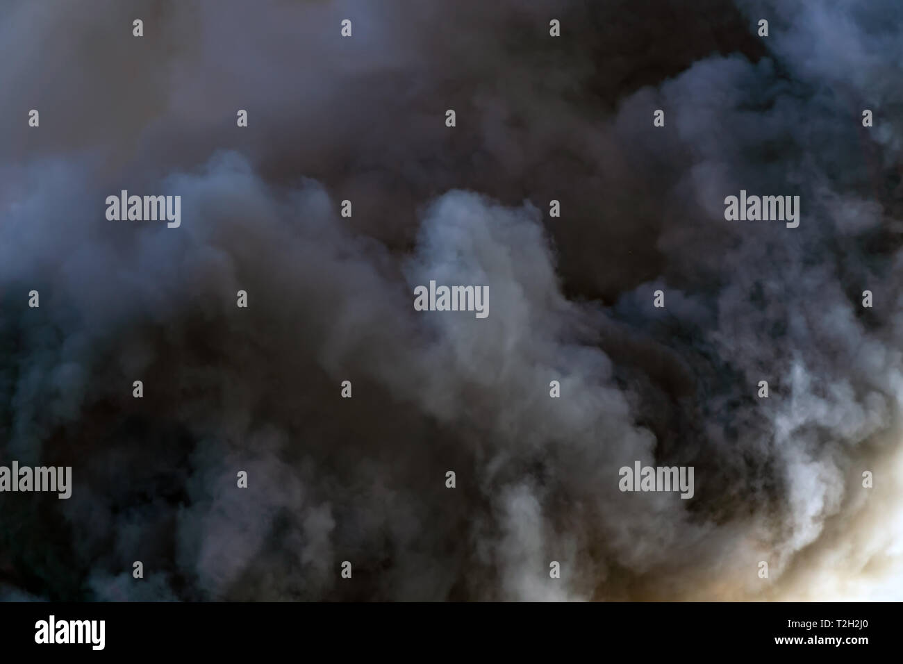 Thick black acrid smoke on the sky background Stock Photo - Alamy