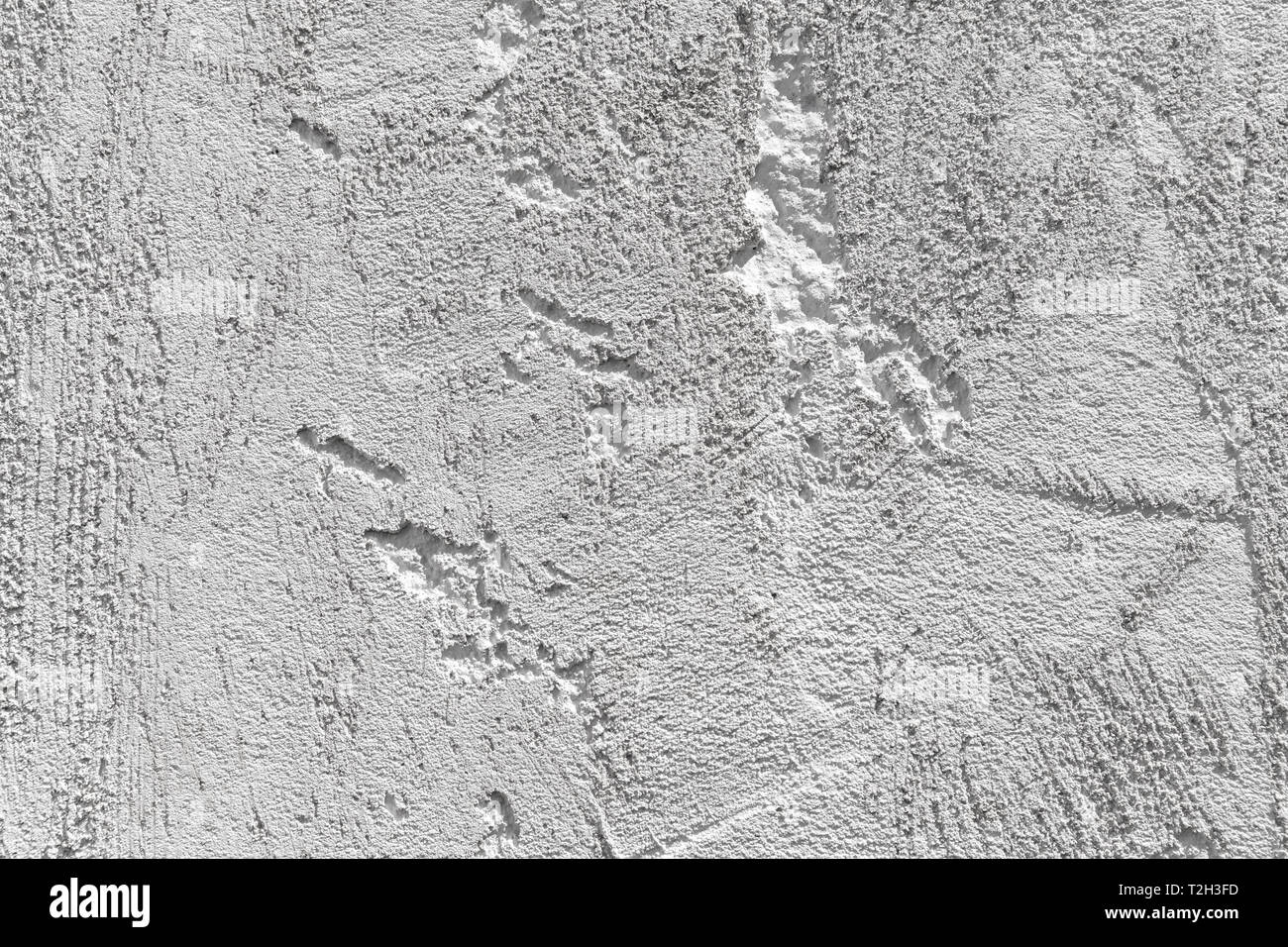 Gray concrete wall with faded stucco layer, close-up flat background ...