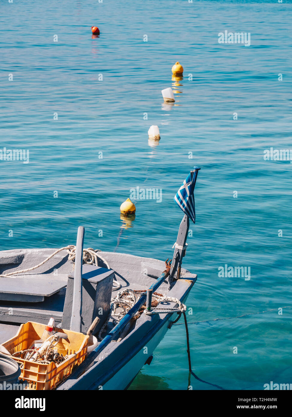 Traditional greek fishing boat with Greek Flag in Limenas Port, Thasos ...