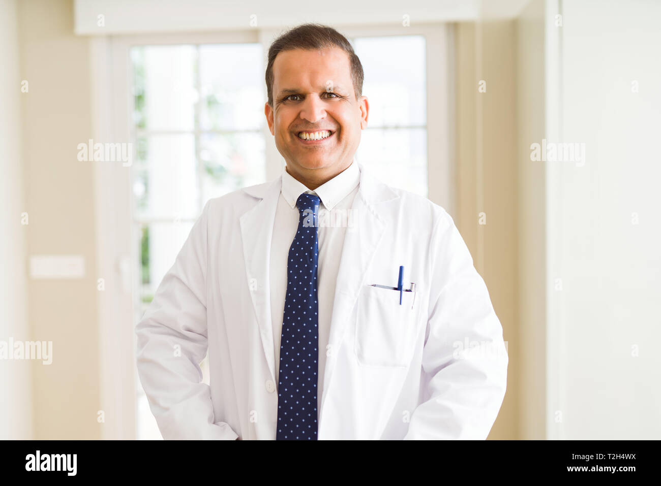 Senior cardiologist wearing white coat hi-res stock photography and ...