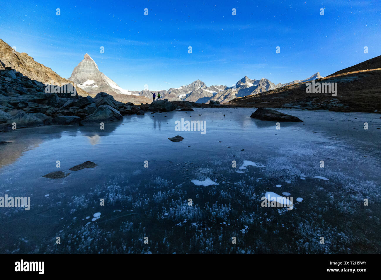 Frozen Riffelsee lake by Matterhorn in Switzerland, Europe Stock Photo ...