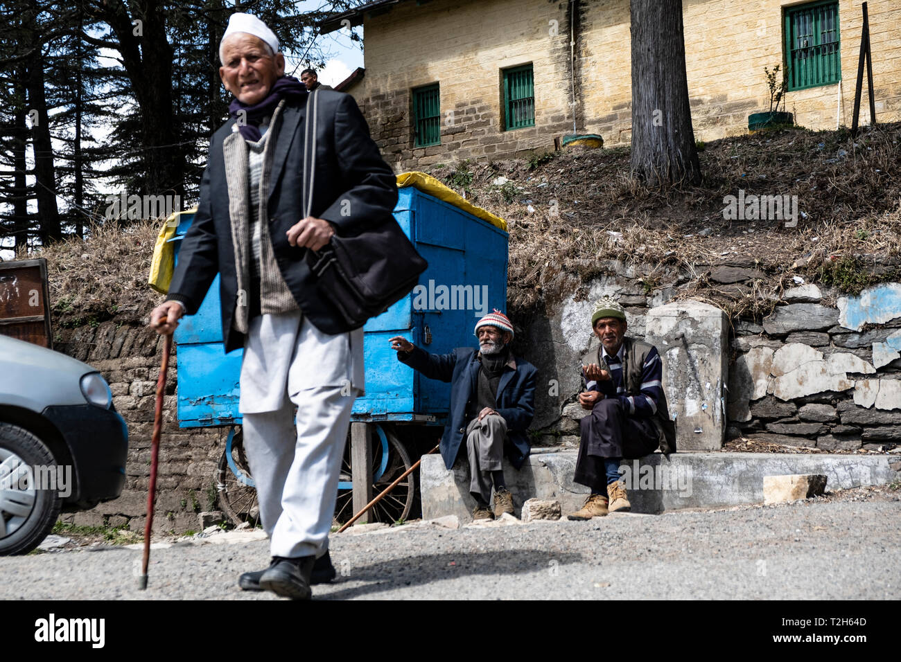 Two old men giving direction to another old man Stock Photo - Alamy