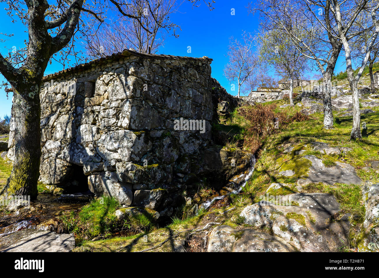 Water mills scattered through the hills in northwestern Spain on the ...