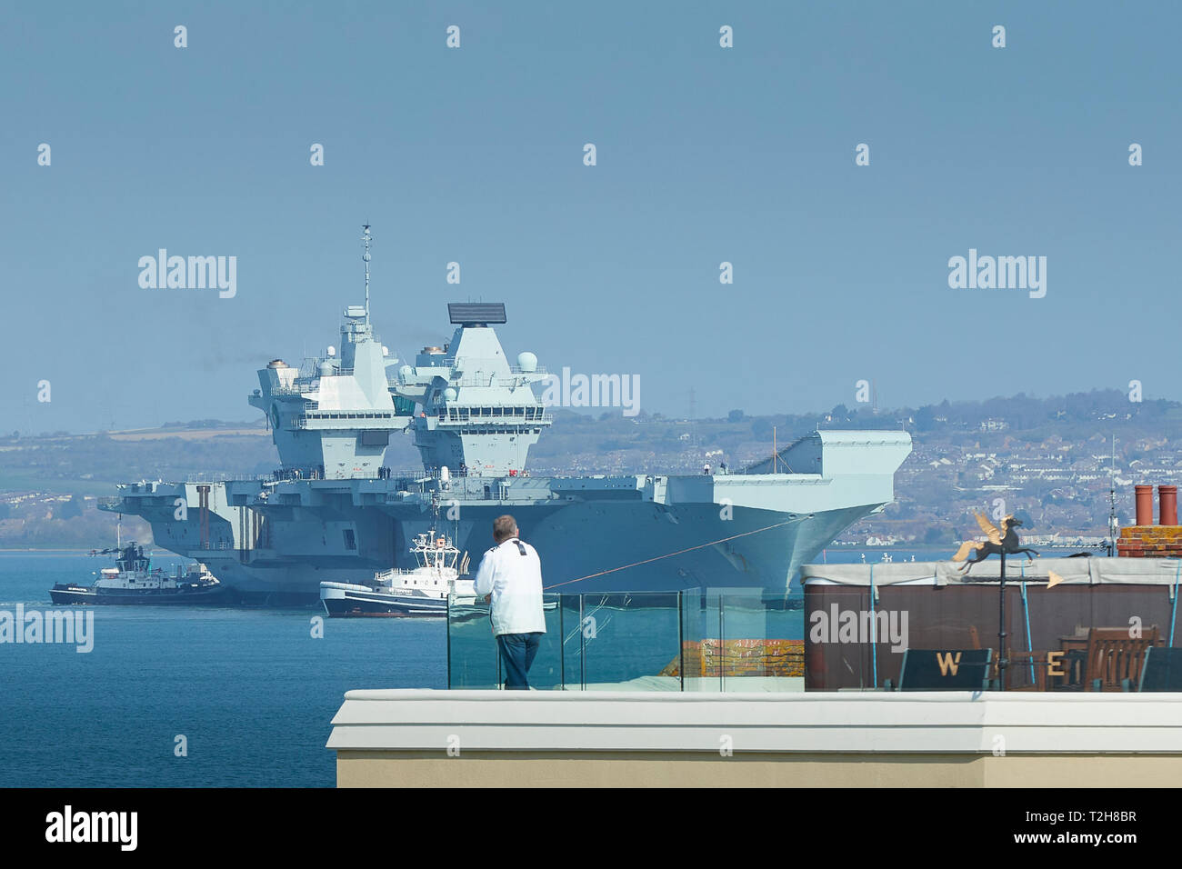 The Royal Navy Aircraft Carrier, HMS QUEEN ELIZABETH, Being Guided From ...