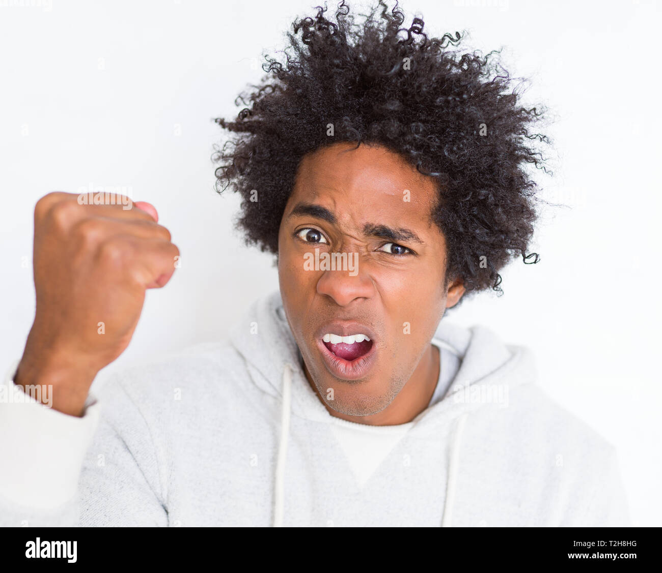 African American man over white isolated background annoyed and ...