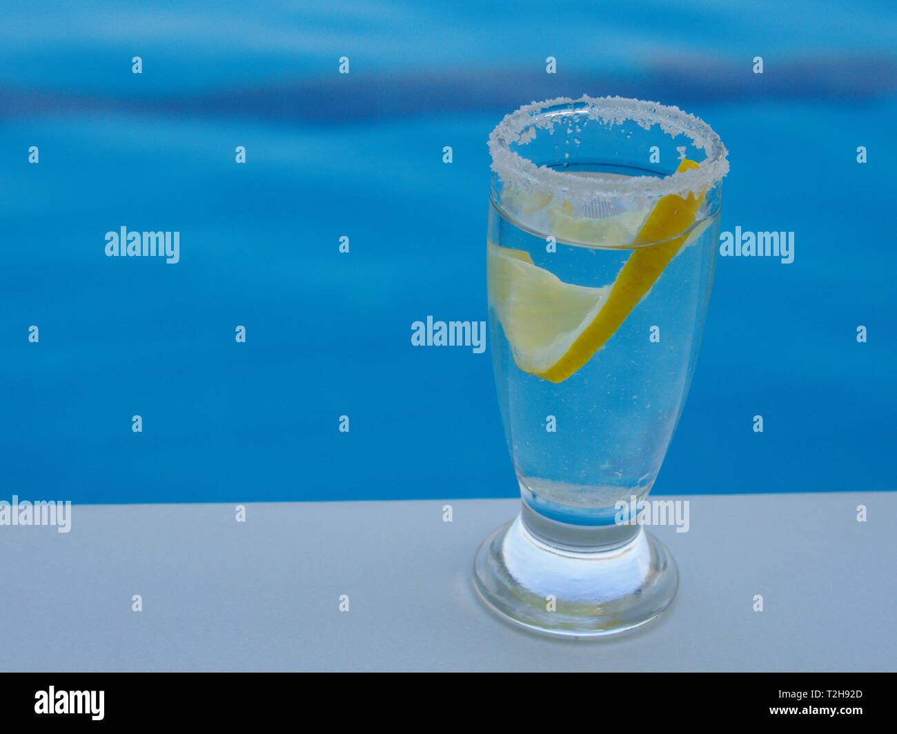 fresh lemon and salted tequila shot by the pool Stock Photo - Alamy