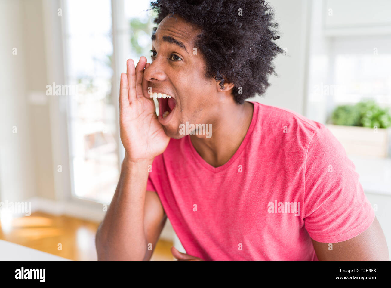 Casual african man shouting screaming hi-res stock photography and ...