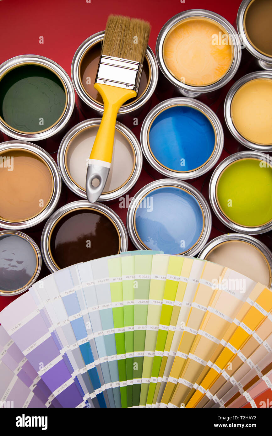 Collection of colored paints cans, Brush, red background Stock Photo ...