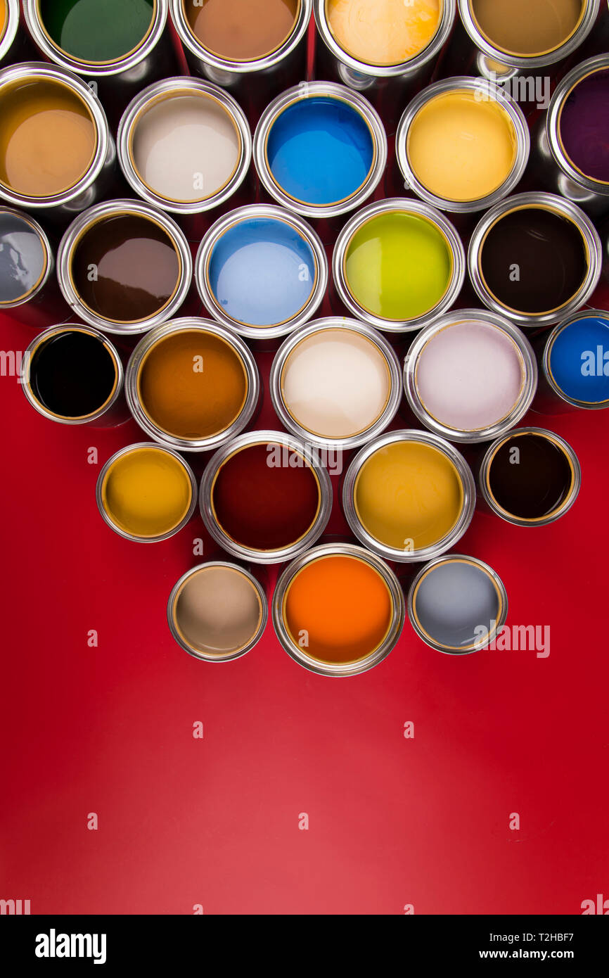 Paint cans color palette, red background Stock Photo - Alamy