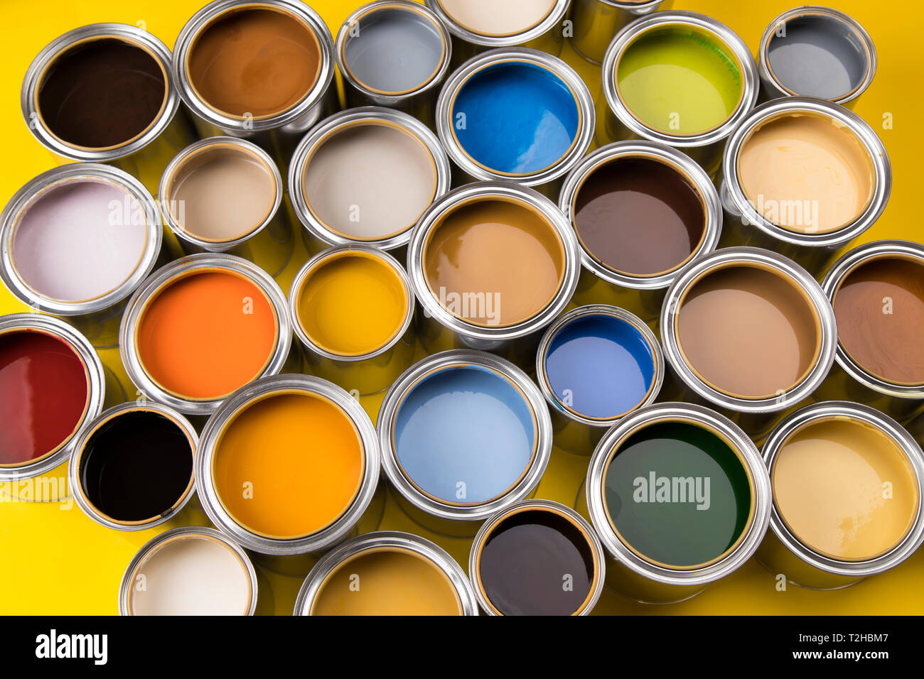 Paint cans color palette, yellow background Stock Photo - Alamy