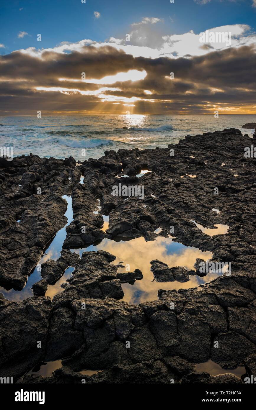 Lava coast at sunset with dark clouds, near Malarrif, peninsula ...