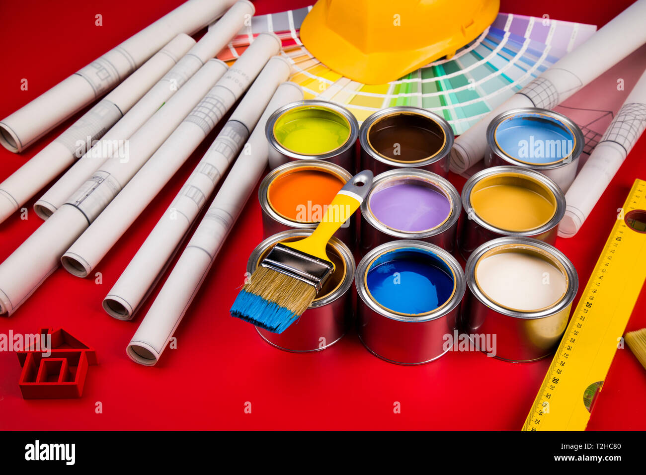 Full Buckets of rainbow colored oil paint on red background Stock Photo ...