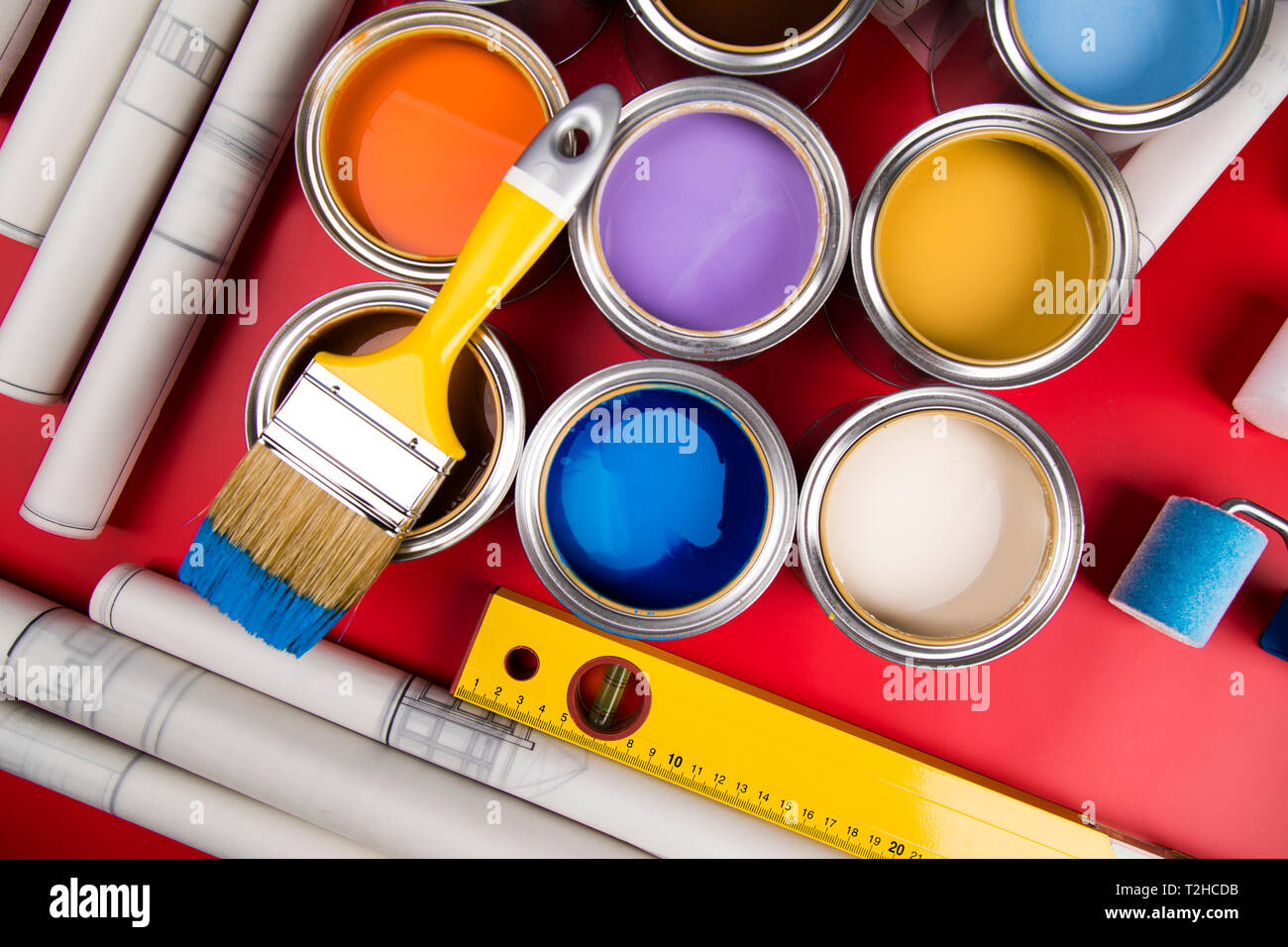 Collection of colored paints cans, Brush, red background Stock Photo ...