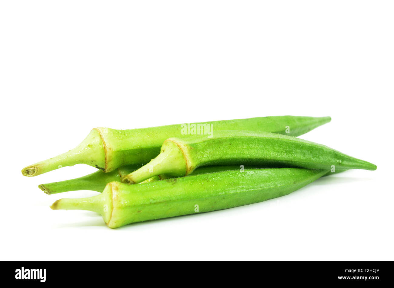 Green okra isolated on a white background Stock Photo - Alamy