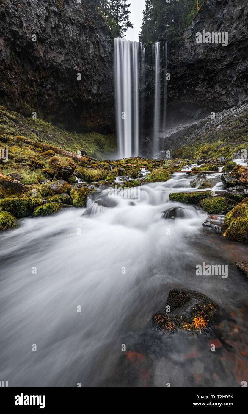 Waterfall flows over rocky outcrop, long term exposure, River Cold ...