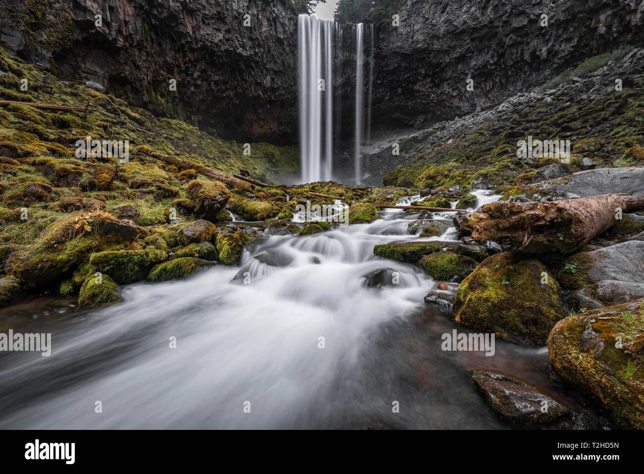 Waterfall plunges over rocky outcrop, Tamanawas Falls, time exposure ...