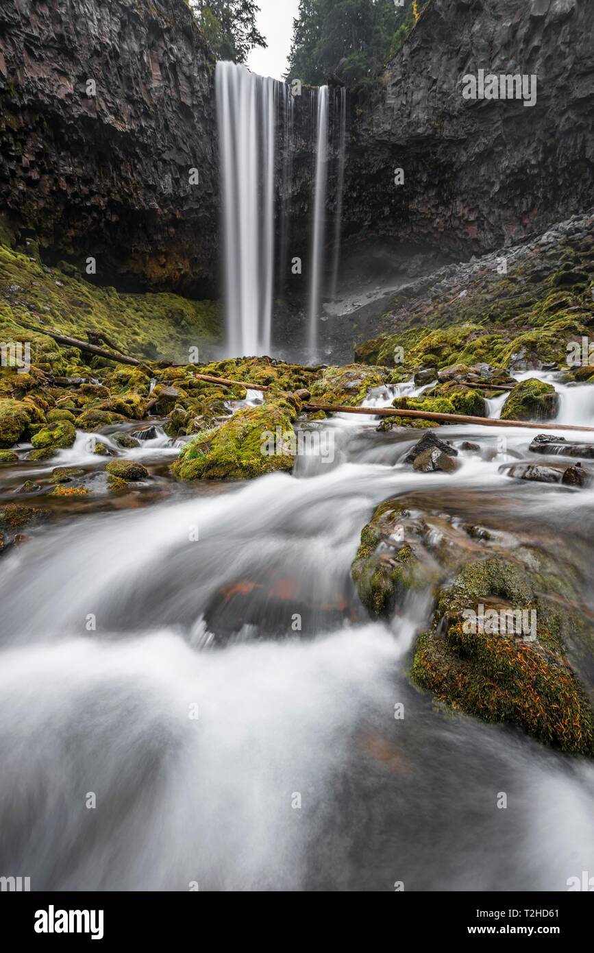 Waterfall flows over rocky outcrop, long term exposure, River Cold ...