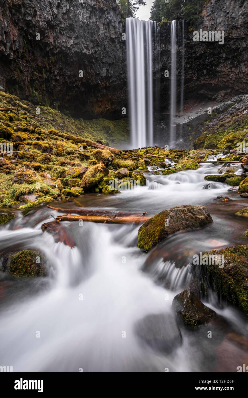Waterfall flows over rocky outcrop, long term exposure, River Cold ...