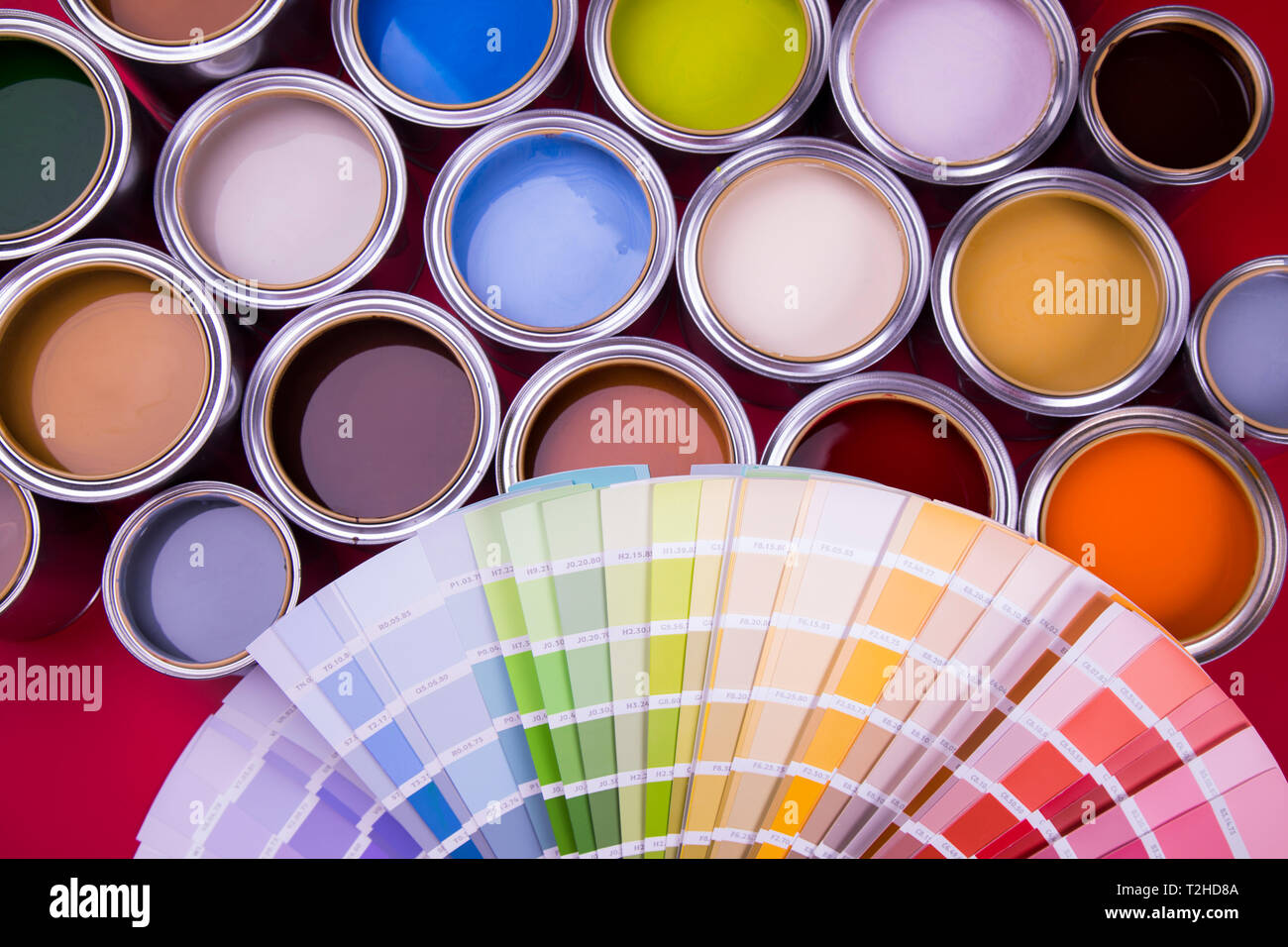 Paint cans color palette, red background Stock Photo - Alamy