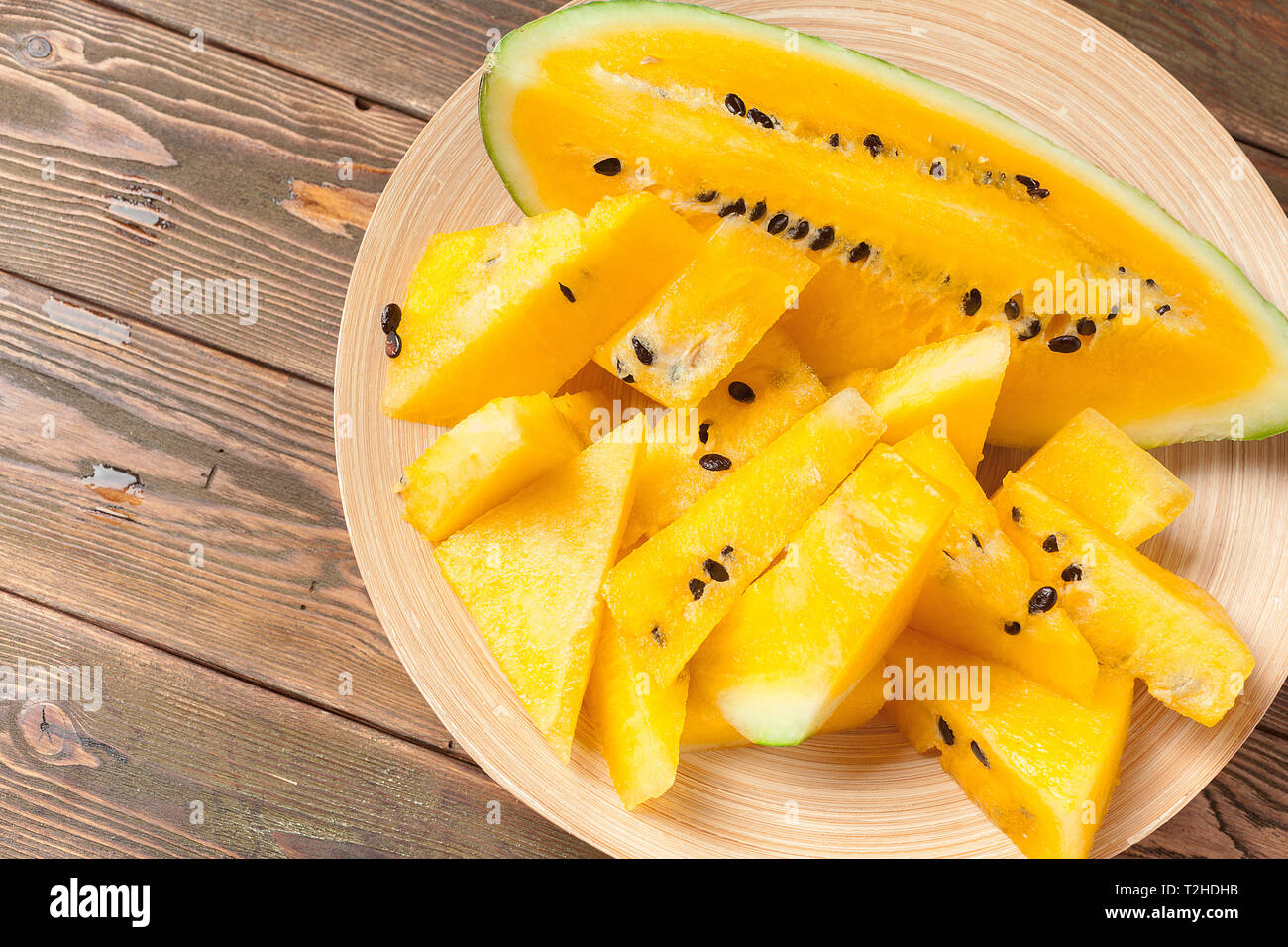 Slice yellow watermelon Stock Photo - Alamy