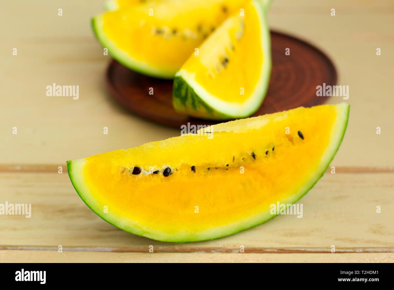 Slice yellow watermelon Stock Photo - Alamy