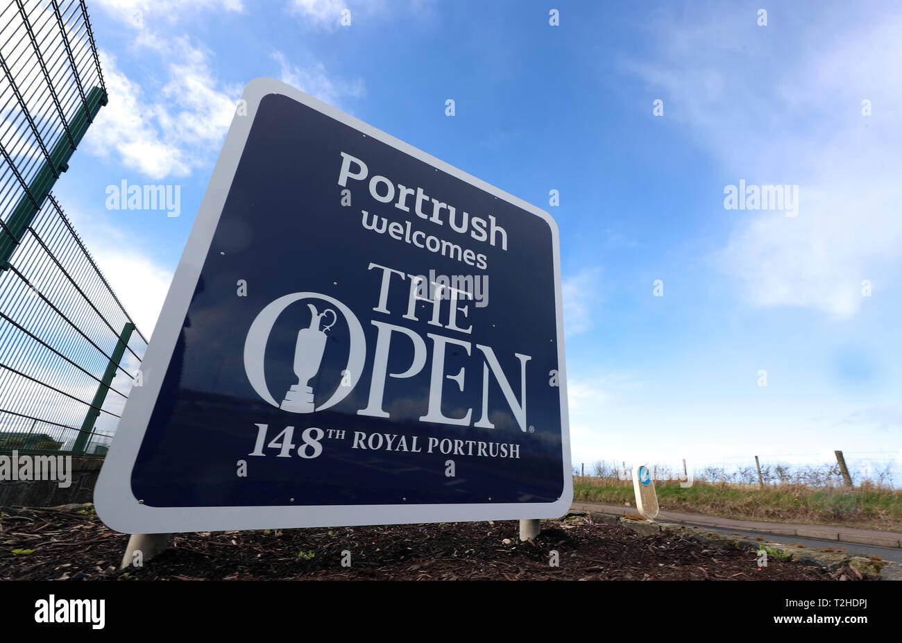 A sign reading 'Portrush welcomes The Open' on a road next to Royal ...