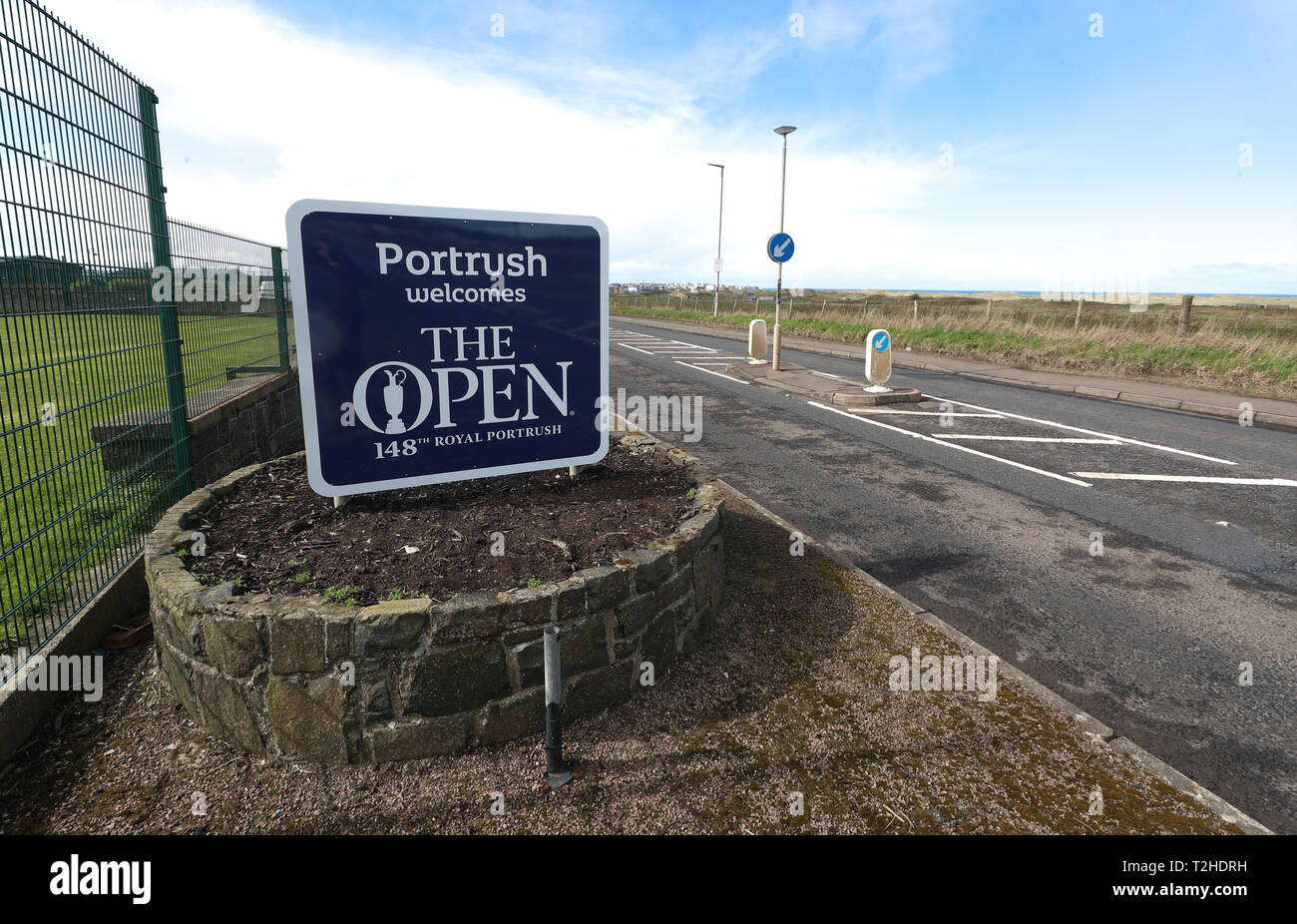 A sign reading 'Portrush welcomes The Open' on a road next to Royal ...