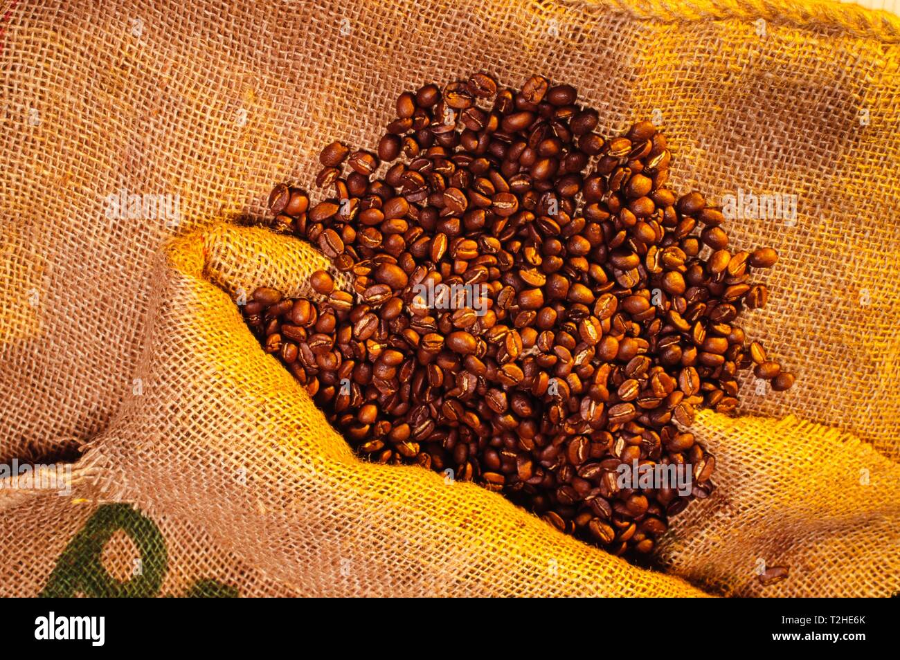 Roasted coffee beans on a jute sack, Germany Stock Photo - Alamy