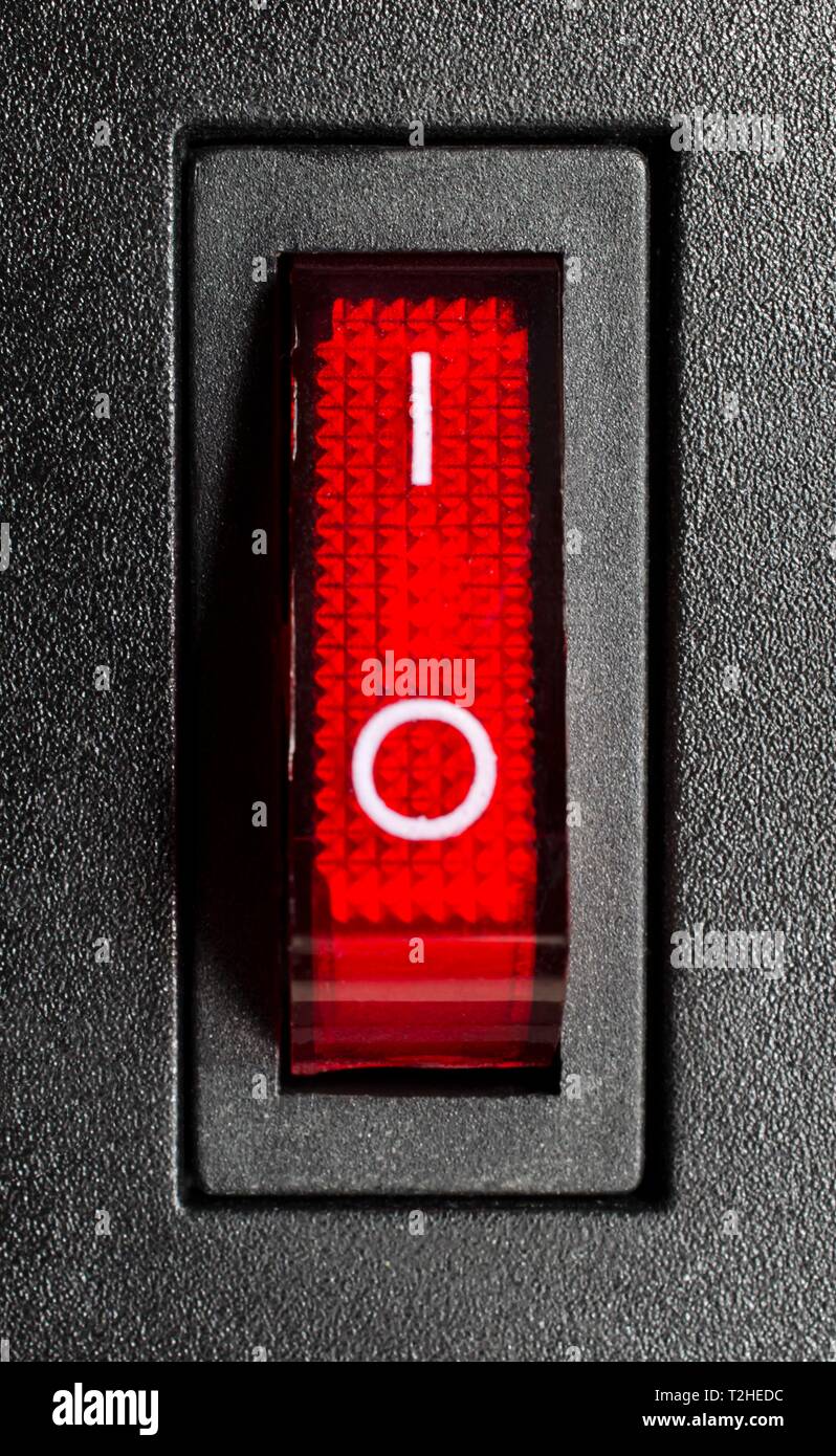 Illuminated switched-on power switch, Germany Stock Photo - Alamy