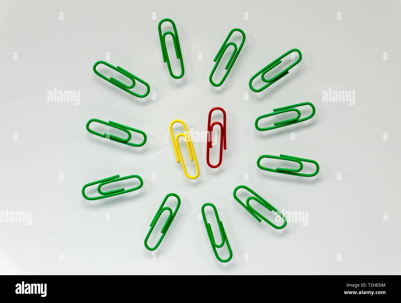 Paperclips, green circular with two red and yellow in the middle ...