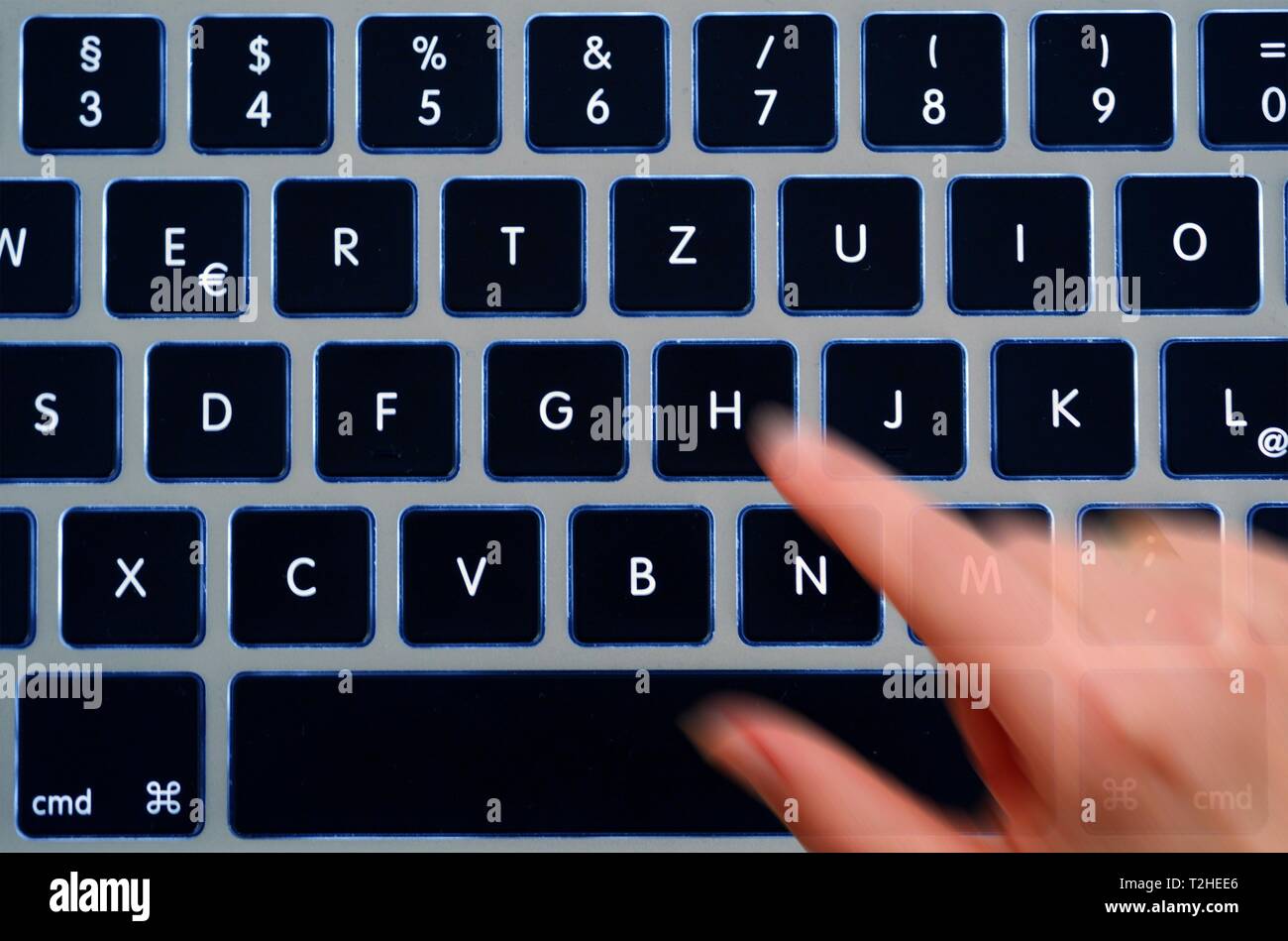 Hand taps computer keyboard hi-res stock photography and images - Alamy