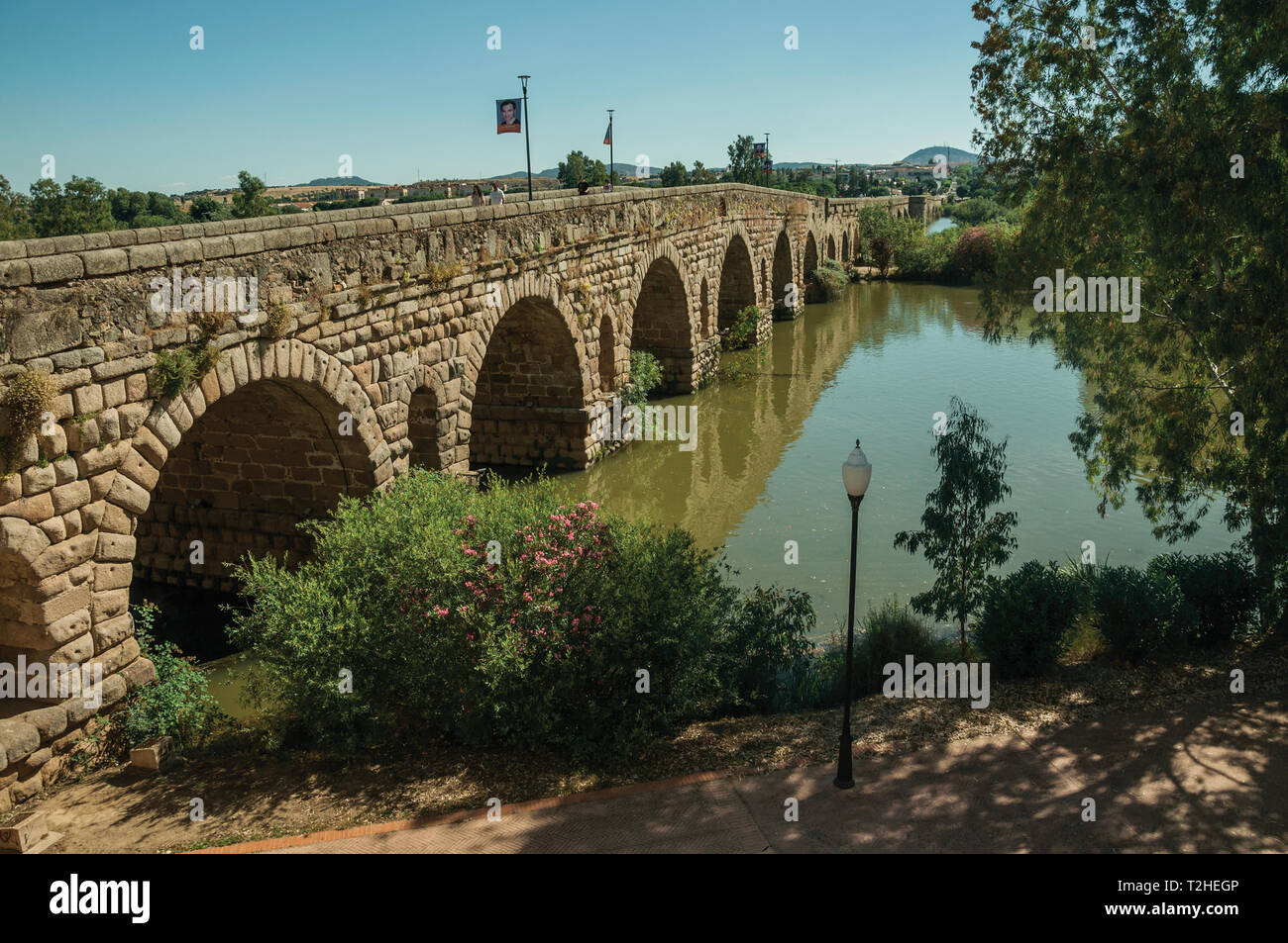The Puente Romano, an old bridge still in use over the Guadiana River ...