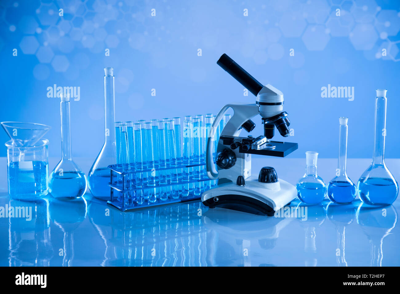 Laboratory beakers,Science experiment, blue background Stock Photo - Alamy