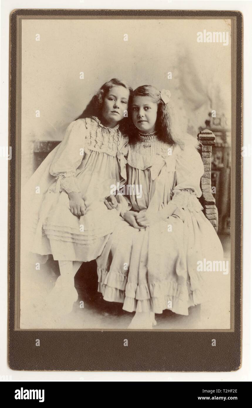 Edwardian cabinet card of 2 sisters, white dresses, loose, frilled ...