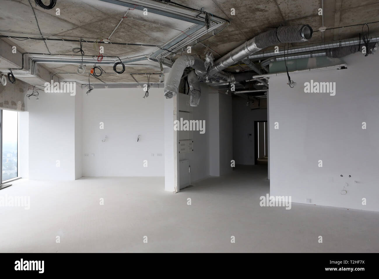 Construction flat, new residential building with cables and ventilation ...