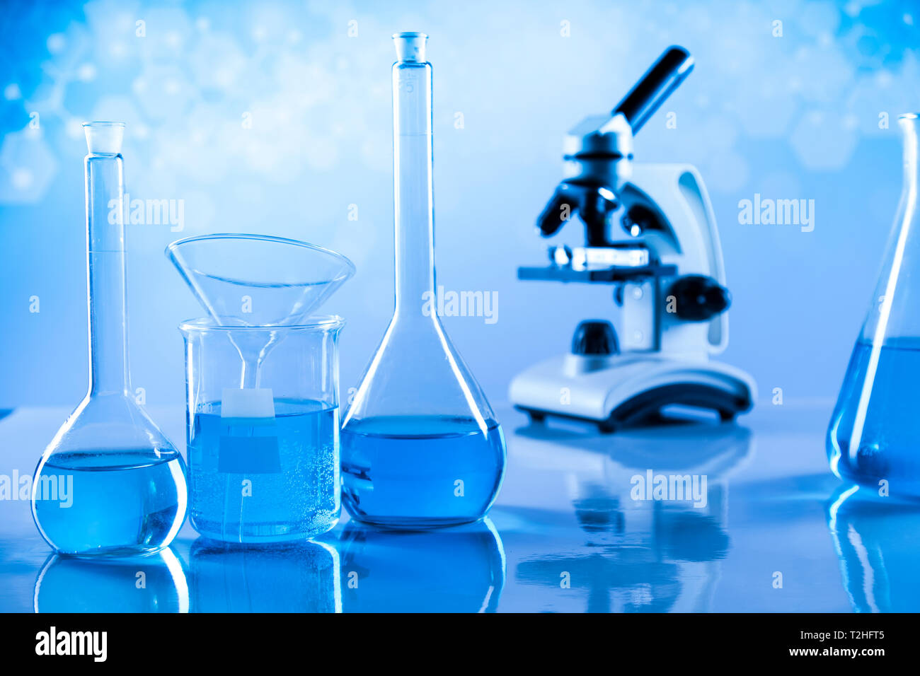 Laboratory beakers,Science experiment, blue background Stock Photo - Alamy