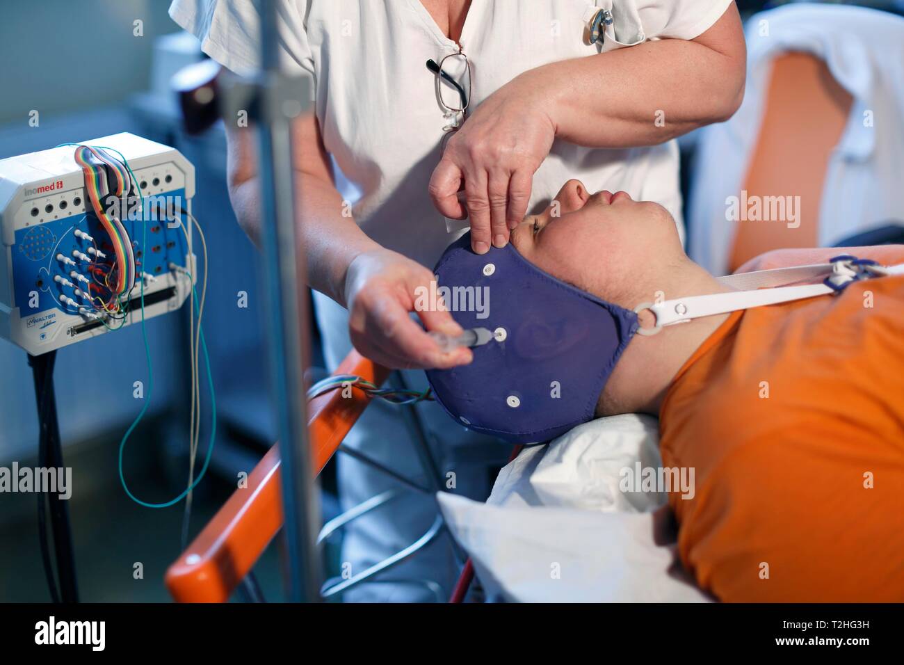 Electroencephalography, EEG, patient in neurological brain examination ...