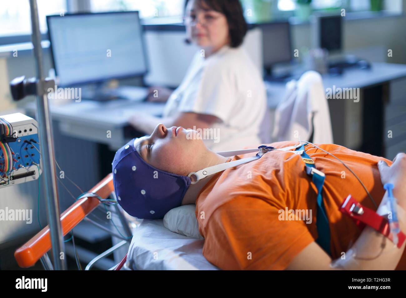 Electroencephalography, EEG, patient in neurological brain examination ...