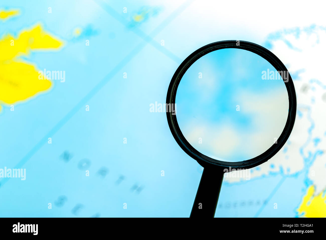 Magnifying glass and map Stock Photo - Alamy