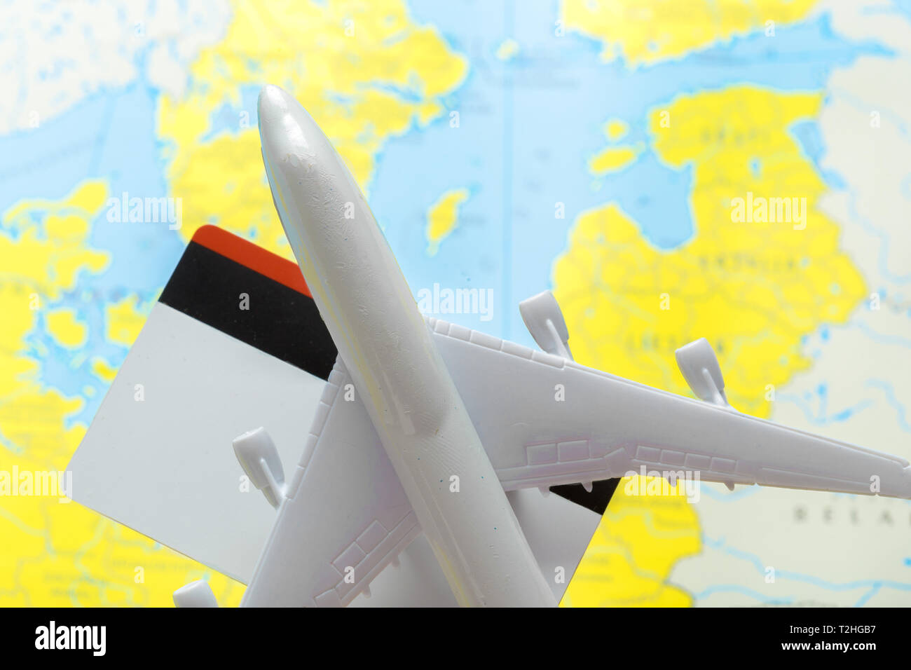 miniature of a passenger aircraft flying on a map Stock Photo - Alamy