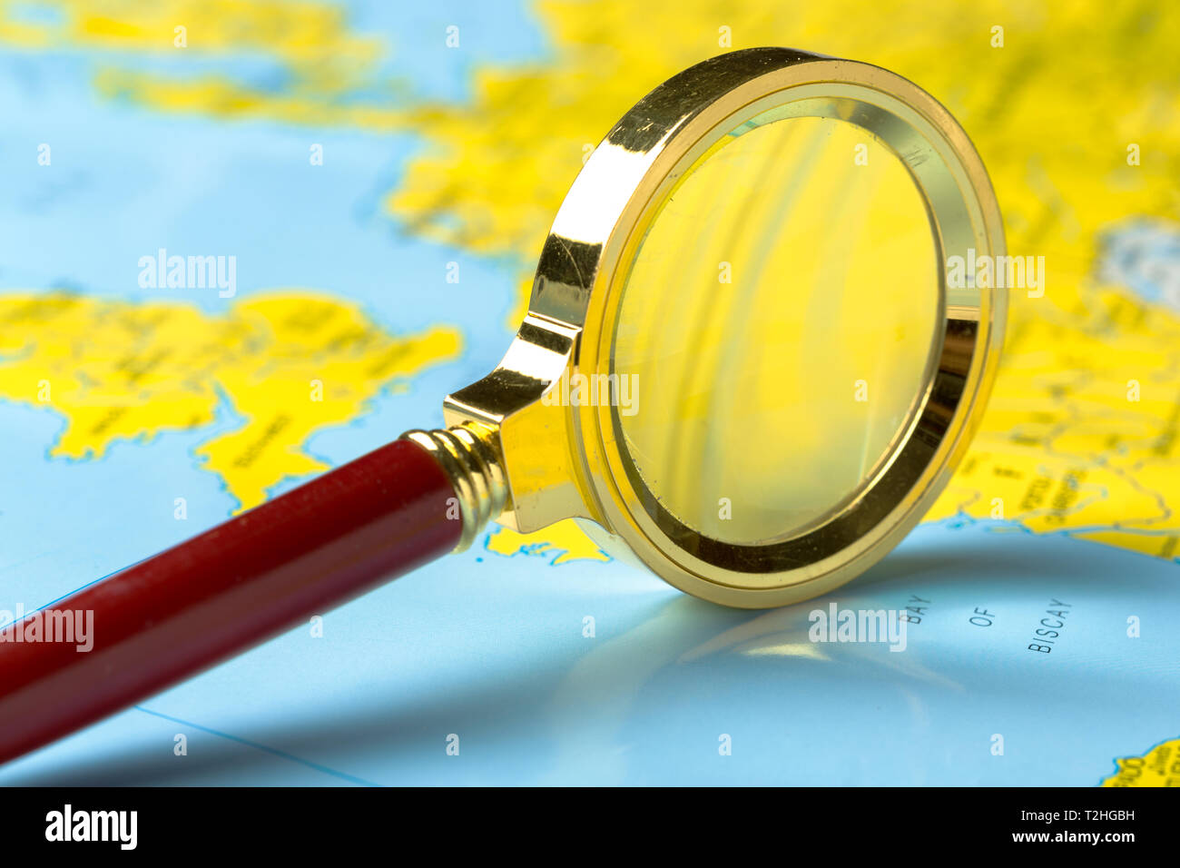Magnifying glass and map Stock Photo - Alamy