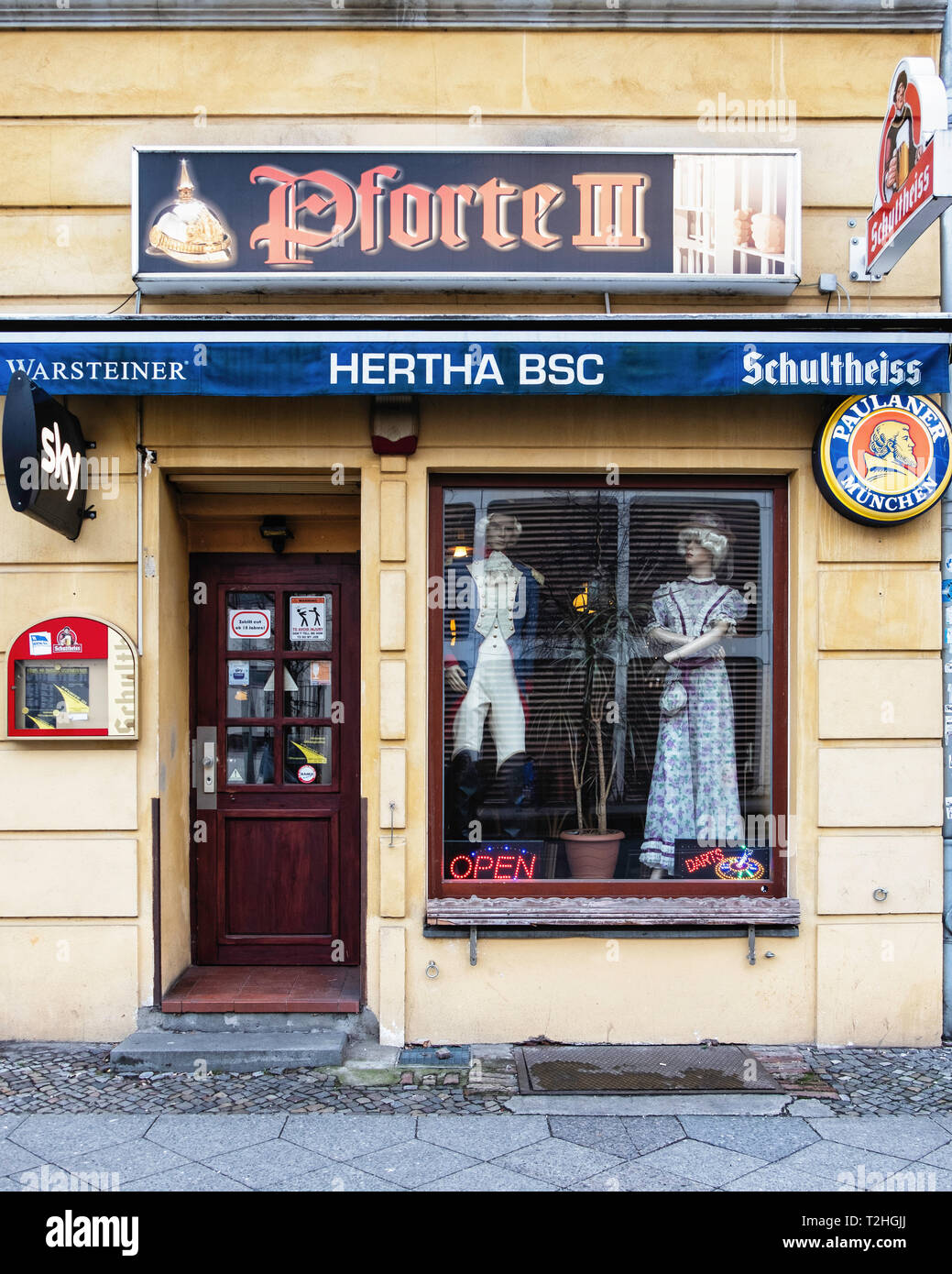 Pforte lll traditional old bar. Exterior view with models in period ...