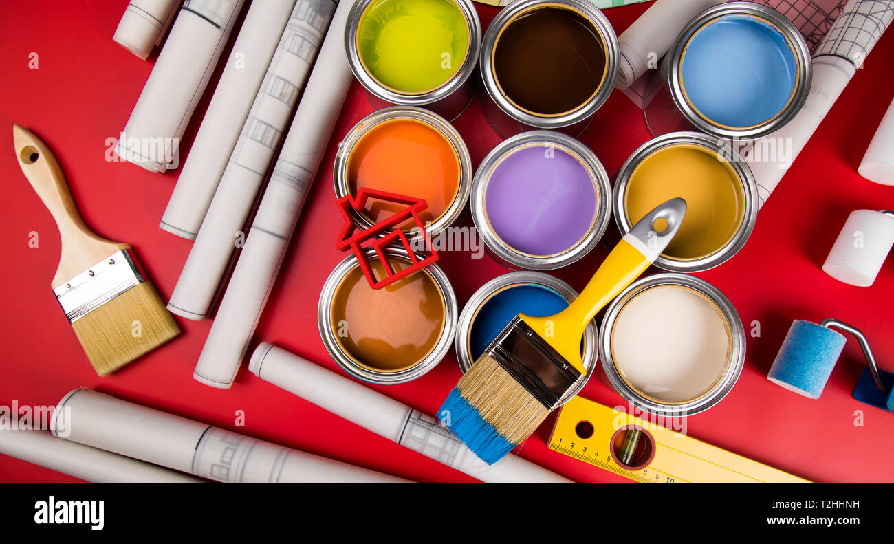 Collection of colored paints cans, Brush, red background Stock Photo ...