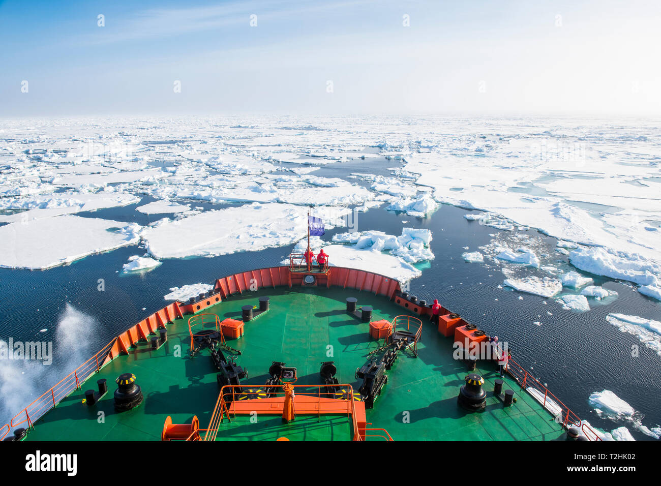 People enjoying the breaking ice on board of an icebreaker, North Pole ...
