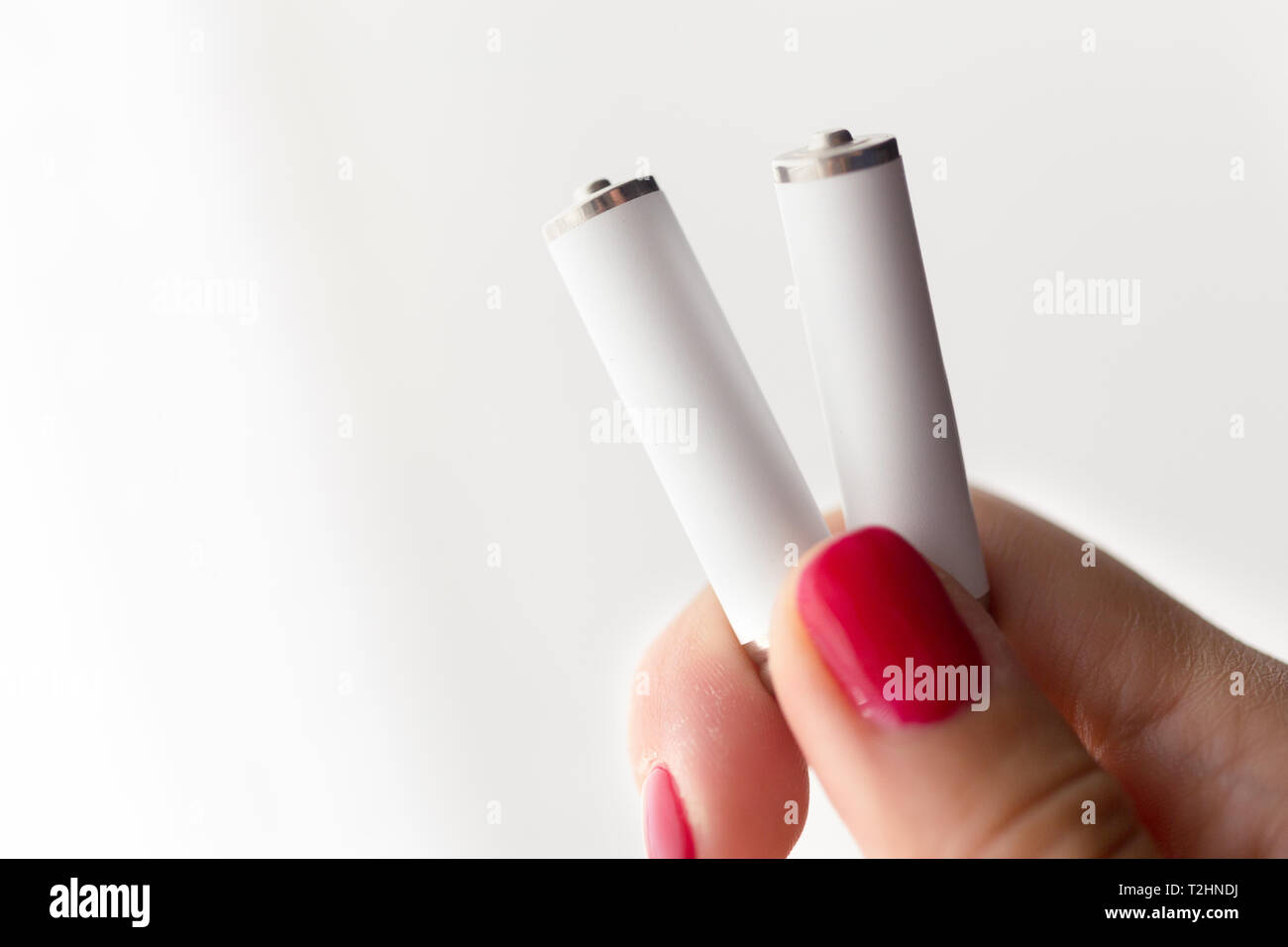 Batteries in hand Stock Photo - Alamy