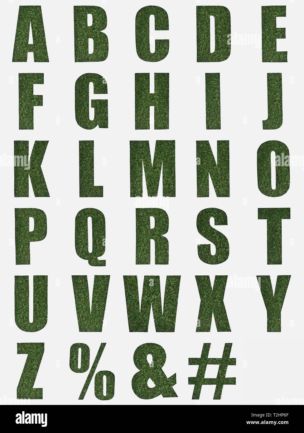 letters from English alphabet made of green grass isolated on white ...