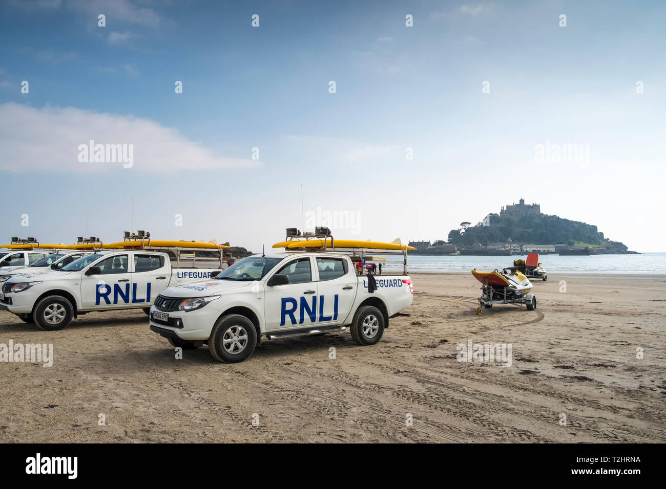 RNLI Lifeguards vehicles on beach at Marizion, Cornwall, England, UK ...