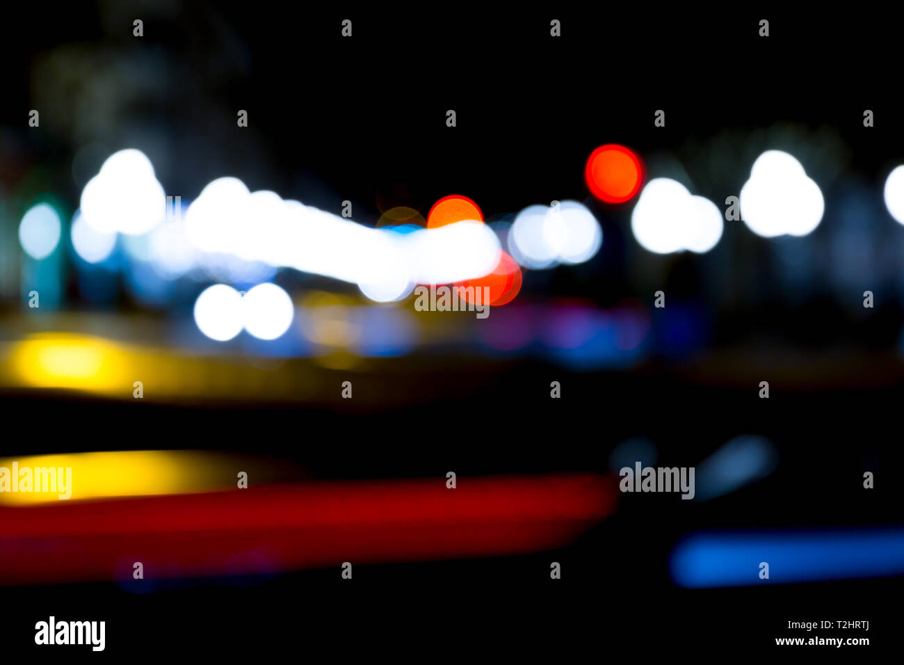 abstract traffic lights on urban street at night, abstract bokeh ...