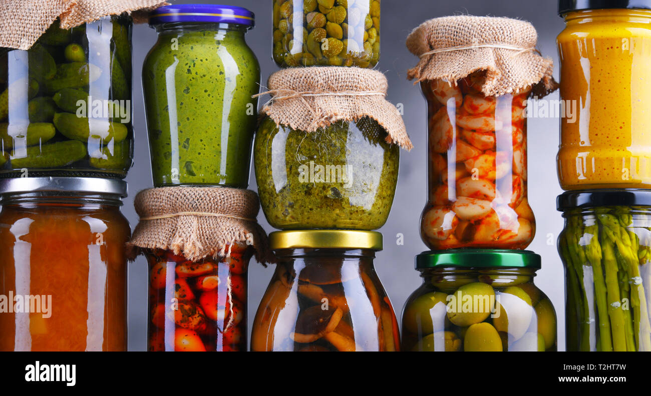 Jars with variety of pickled vegetables and fruits. Preserved food ...
