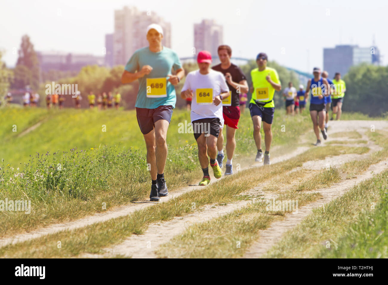 A lot of people on Marathon running in nature Stock Photo - Alamy